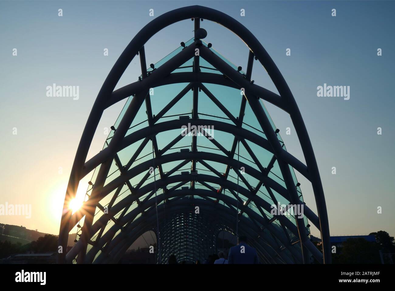 Dazzling sun shining through the Bridge of Peace, stunning landmark of ...