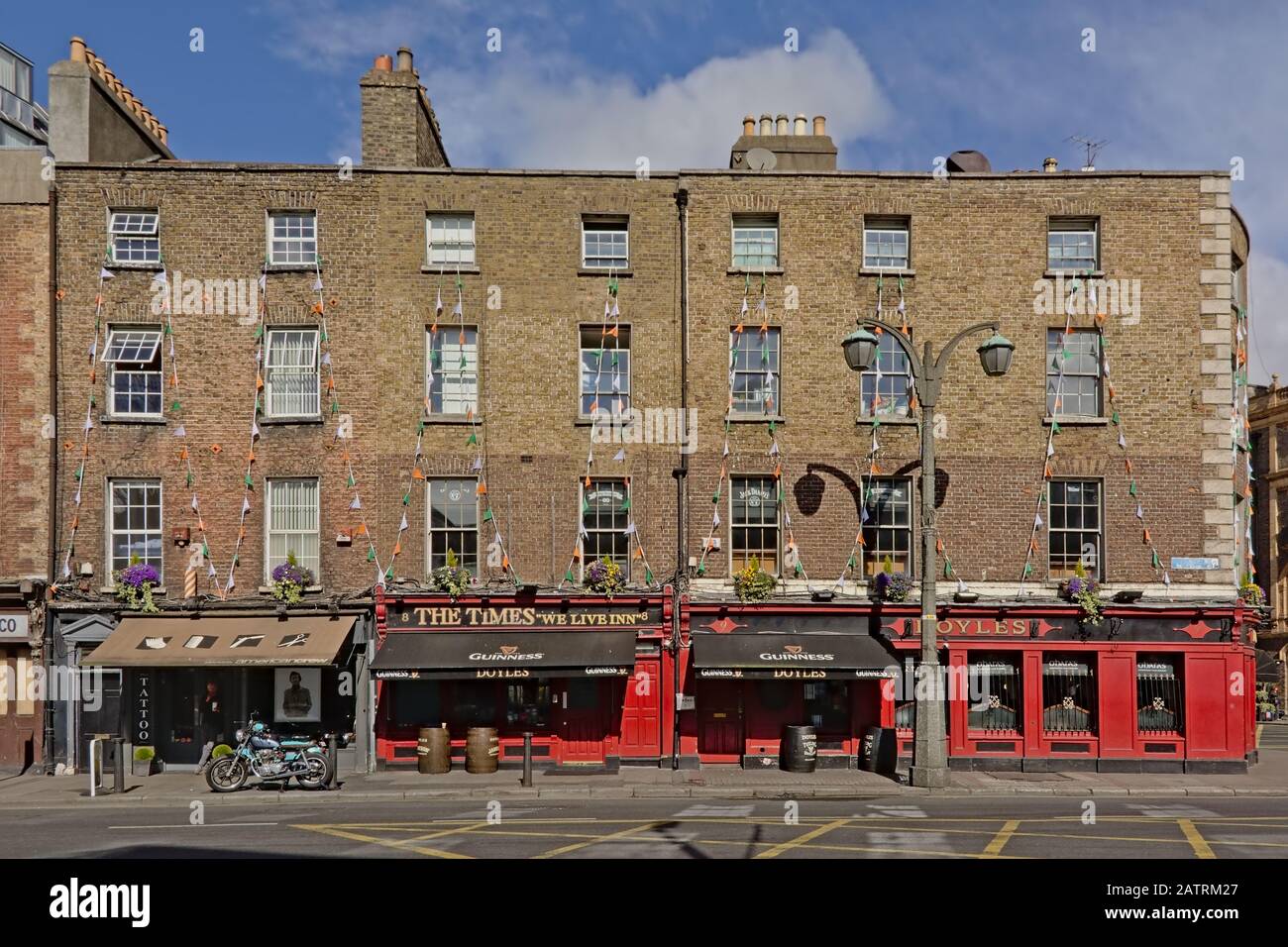 Typical colorful Irish pubs with apartments above in Dublin, Ireland ...
