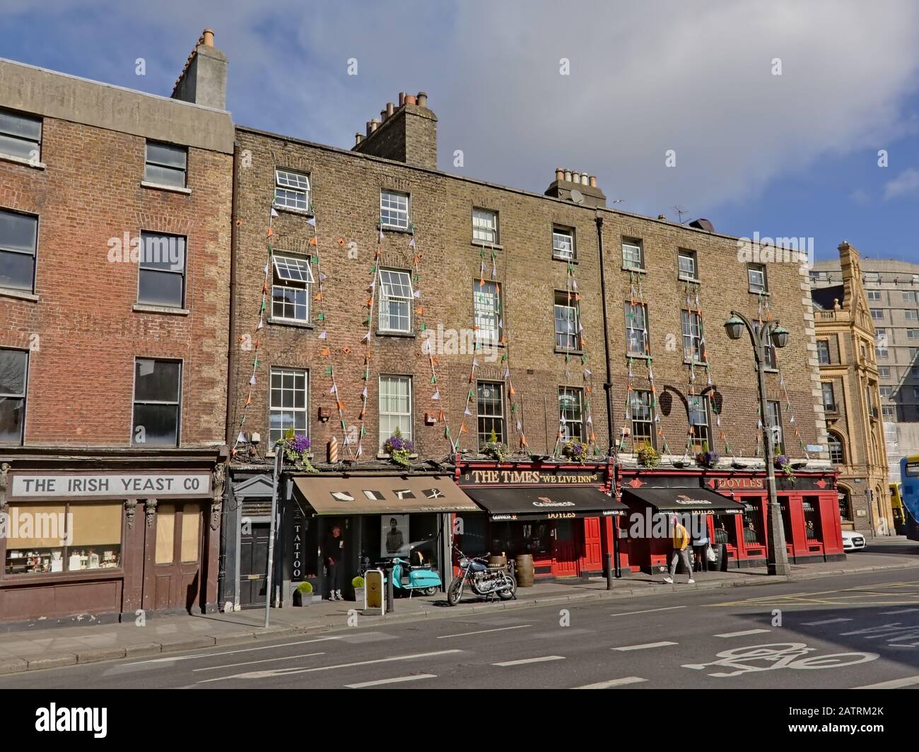 Typical colorful Irish pubs with apartments above in Dublin, Ireland ...