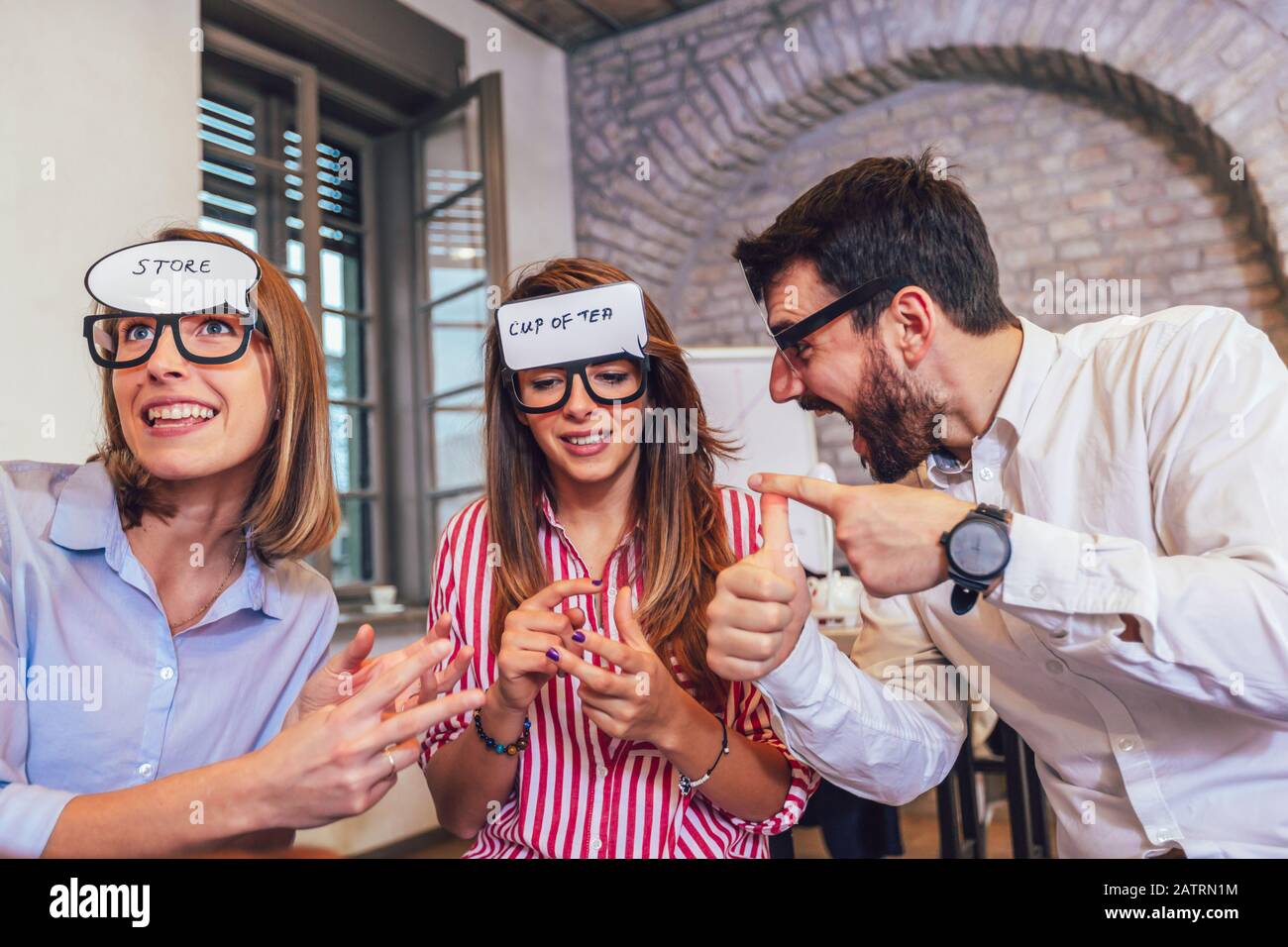 Happy friendly business team having fun at corporate training, funny ...