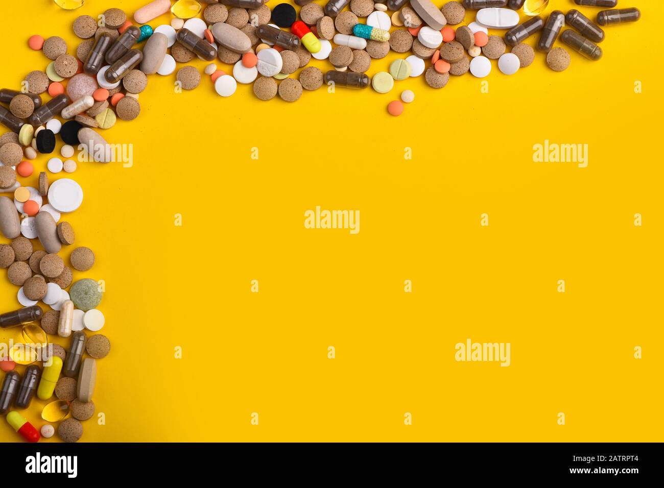 Drugs placed in corner. Frame made of round pills and capsules put on ...