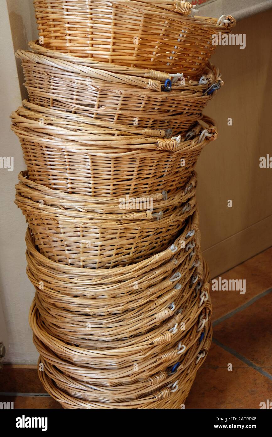 Stack of wicker baskets for shopping in a organic grocery store Stock ...