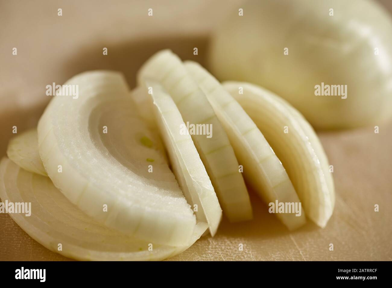 A peeled and sliced yellow onion Stock Photo - Alamy