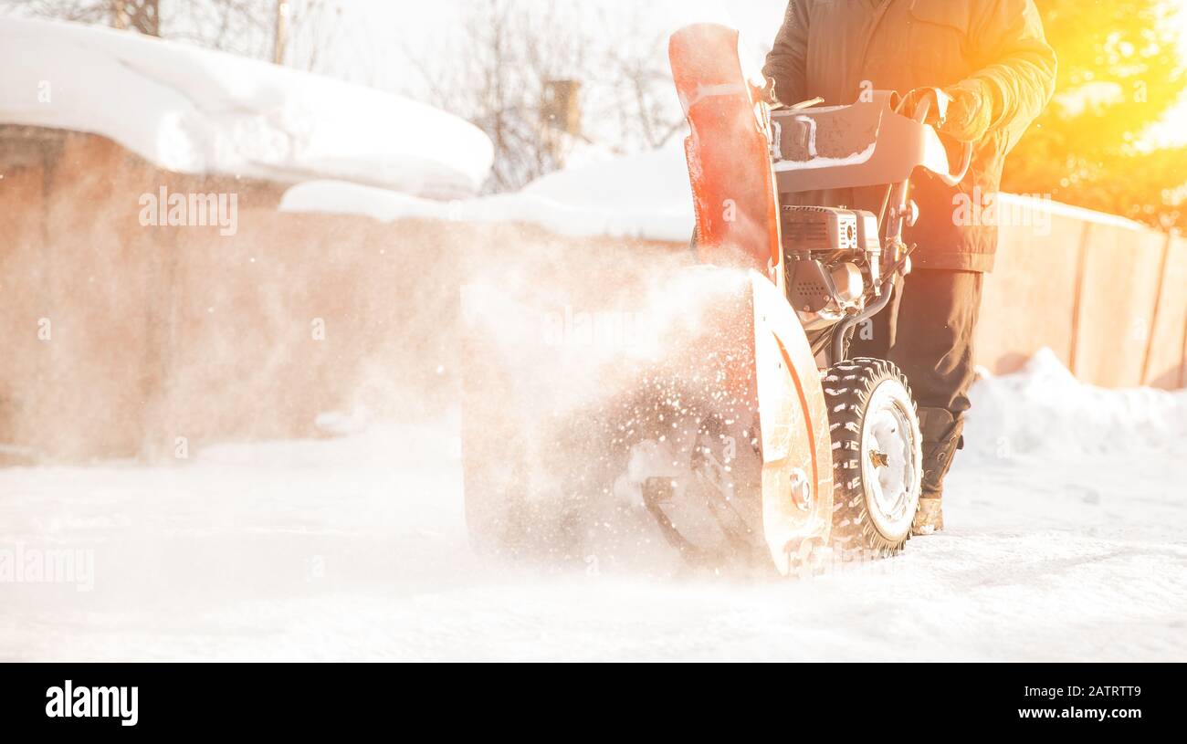 Man cleaning snow from sidewalks with snowblower machine winter Stock ...