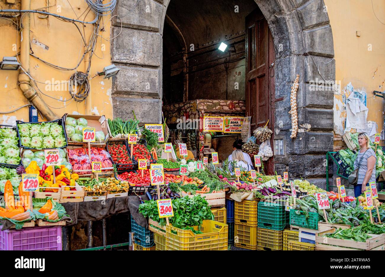 An outdoor fruit and vegetable stall in the Sanita district of Naples ...