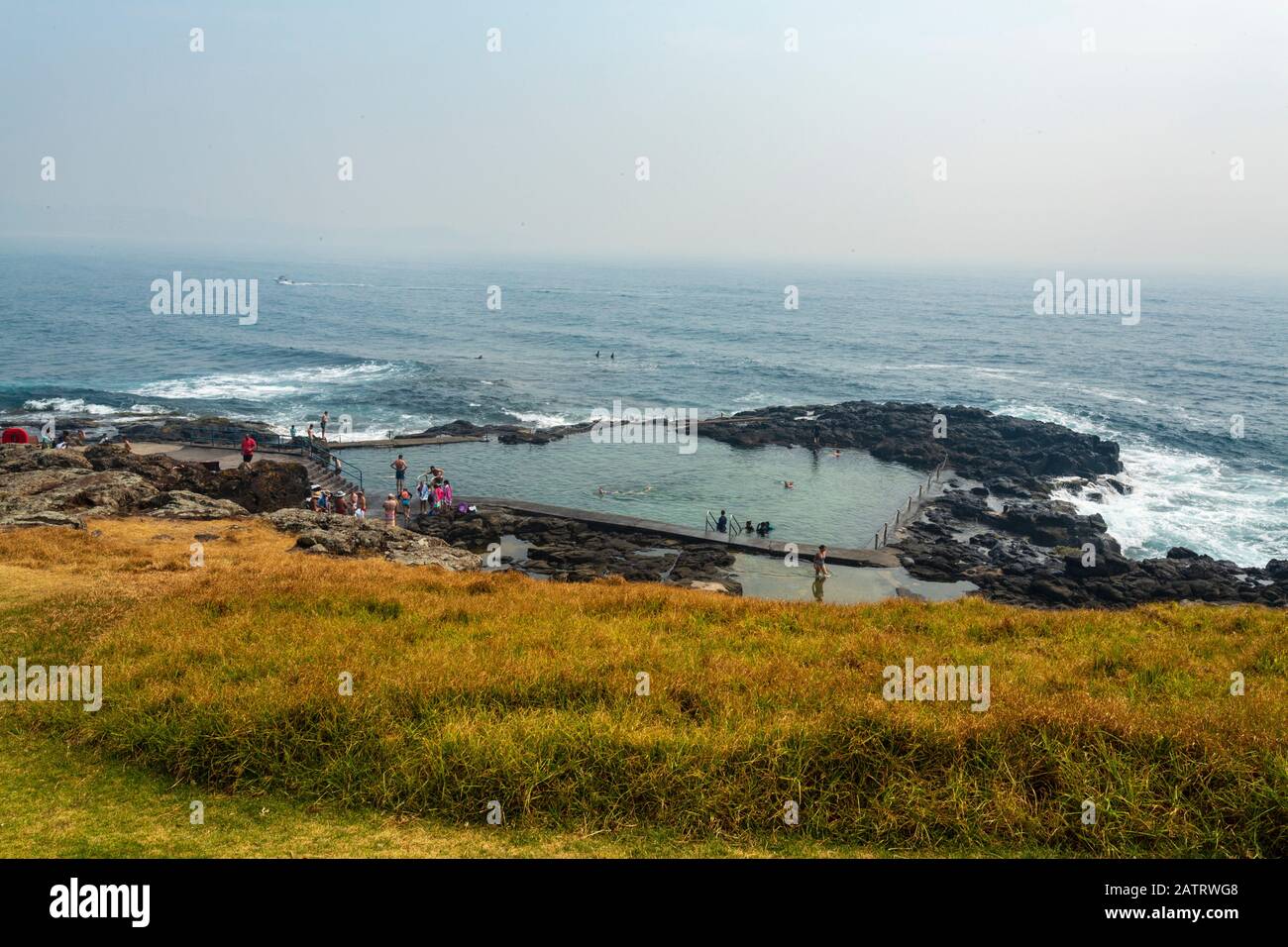 Ocean pool of irregular shape with variable depth and natural rock ...