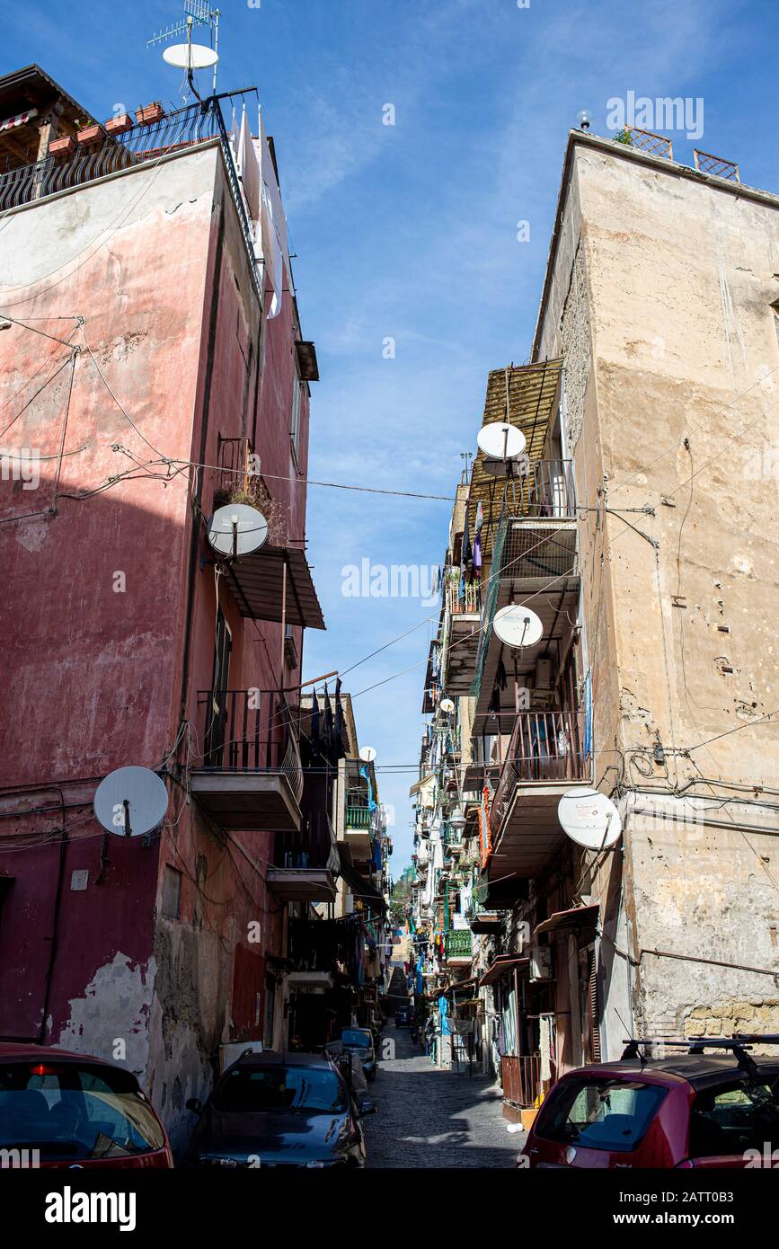 A narrow alley in the Materdei district of Naples, buildings festooned ...