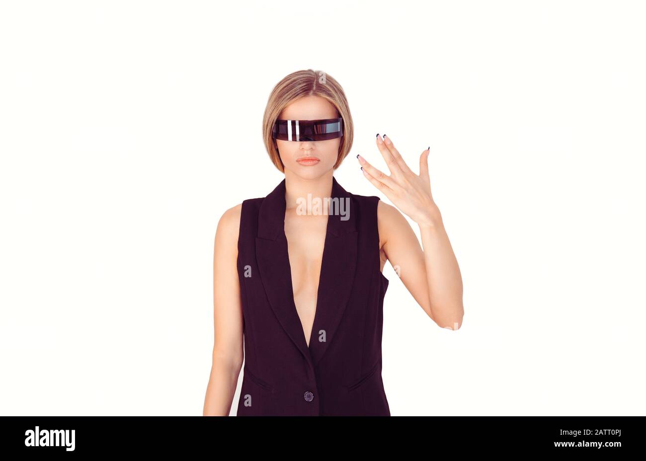 Pretty cyborg woman standing and giving a space salute hand gesture on ...