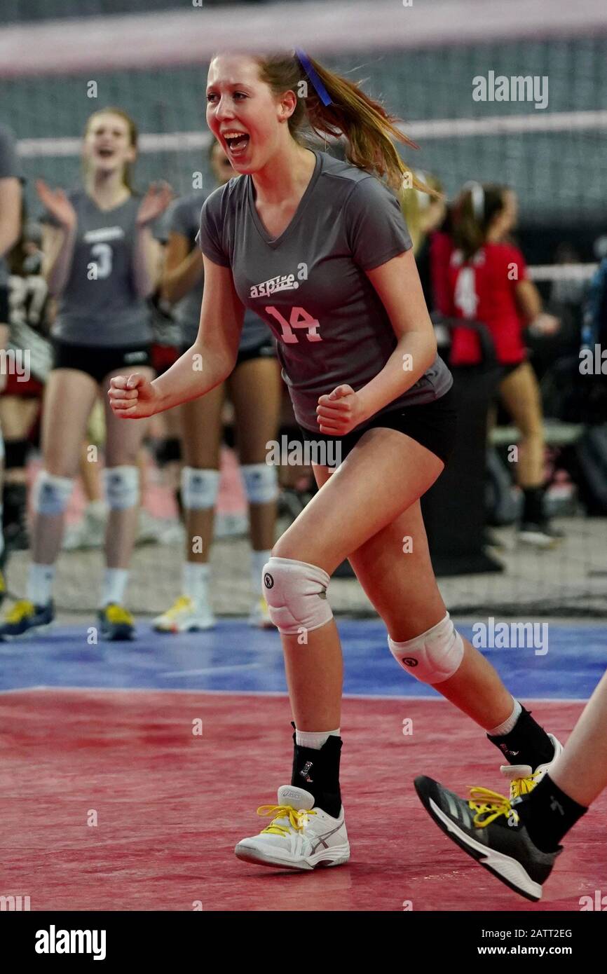 A teenage girl in action while playing volleyball Stock Photo - Alamy