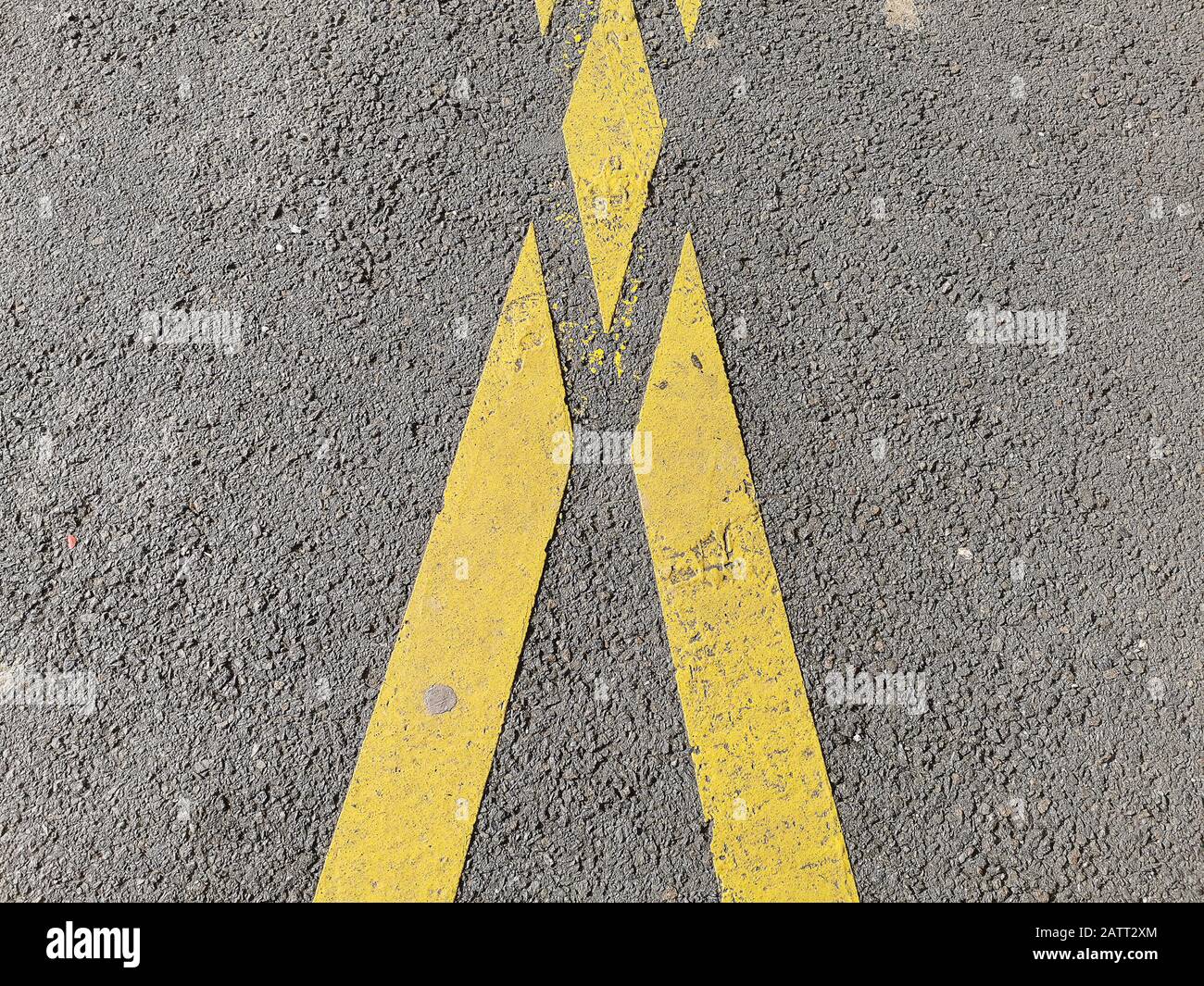 Texture of macadam asphalt with yellow line painted for design ...