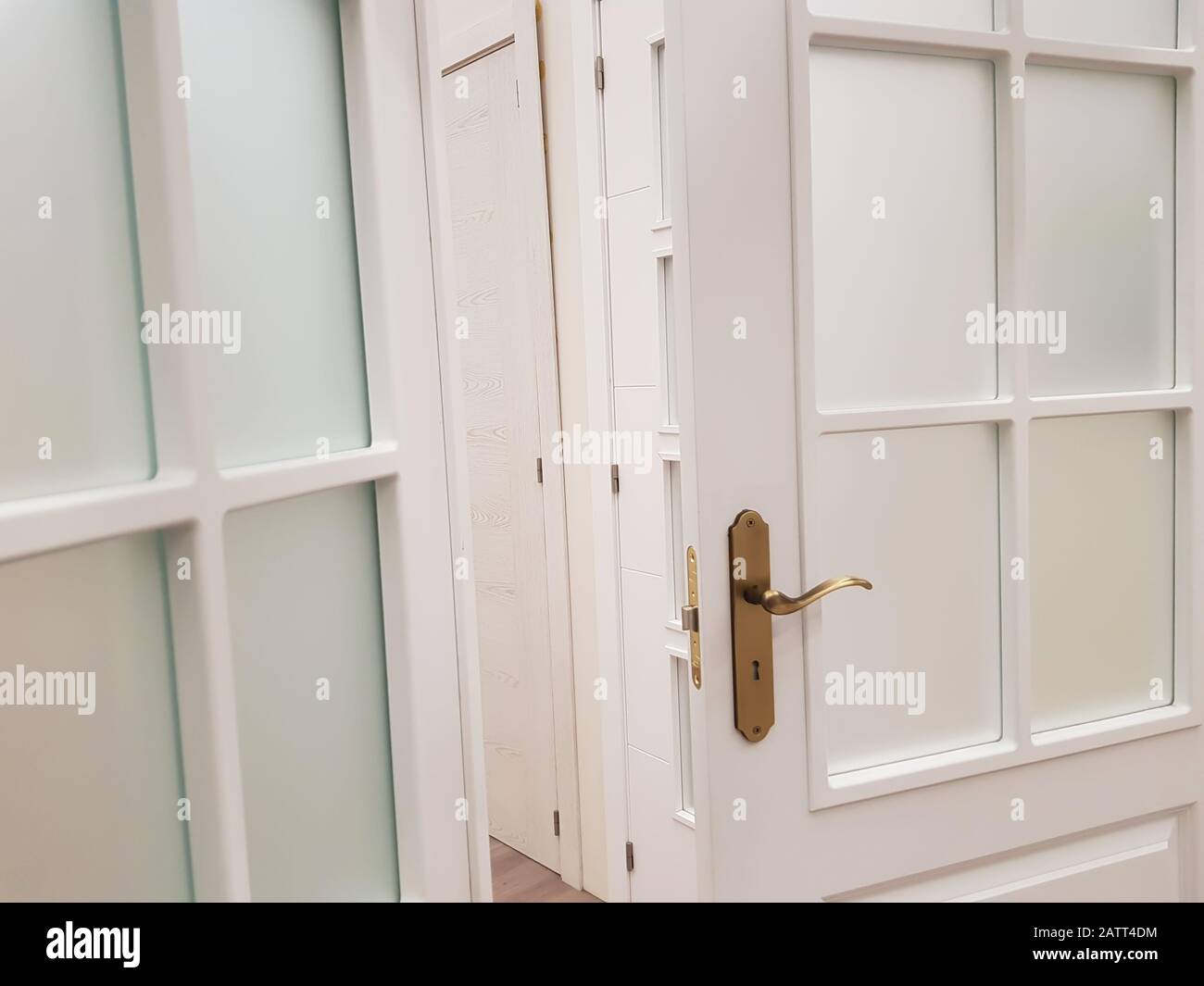 White door half open Stock Photo - Alamy