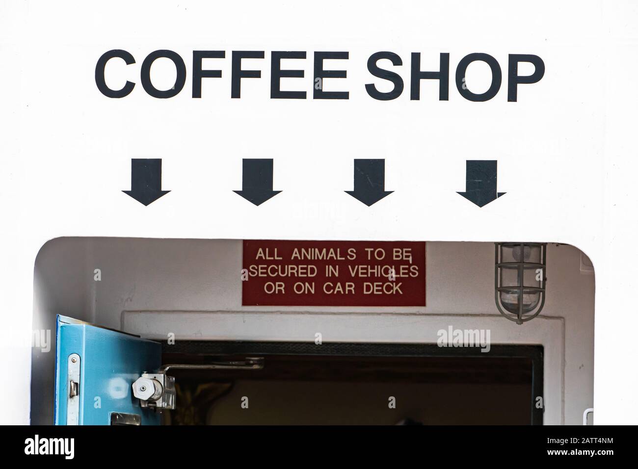 Coffee shop sign with black letters painted on white background, on the ...