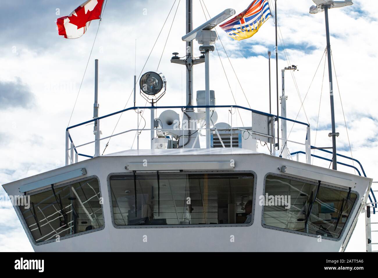 Close up of the command bridge of a passenger ferry. Canadian flag and ...