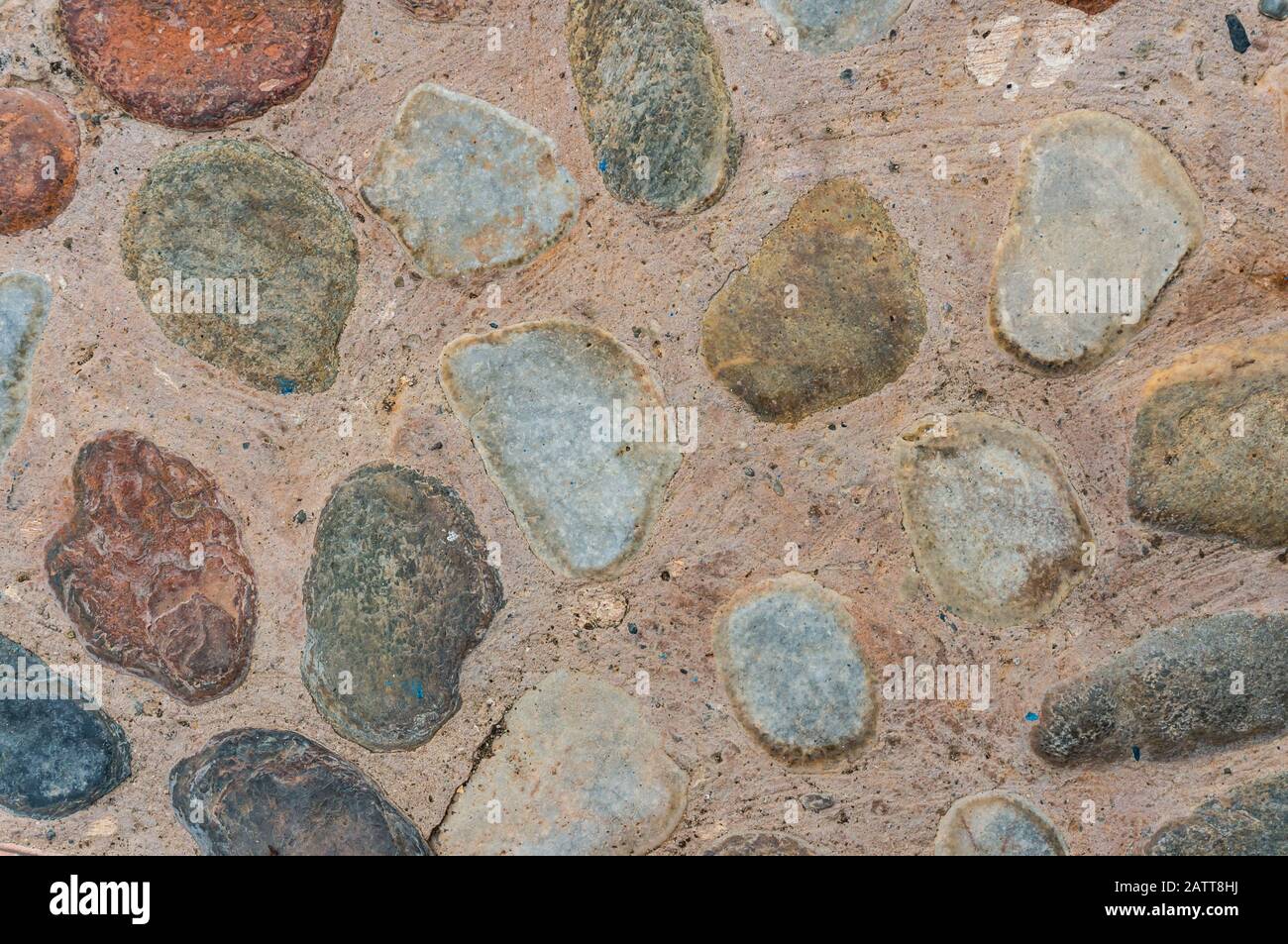 Road is lined with natural stones of various sizes and colors. Vintage ...