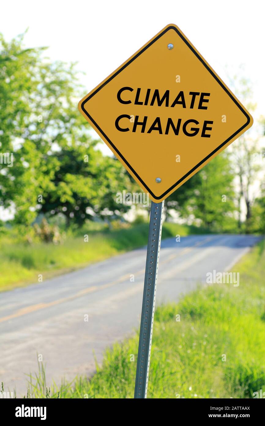 a yellow road side caution sign warning about climate change Stock ...