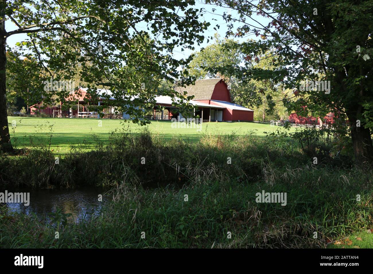 midwest farm barn buildings next to a river Stock Photo - Alamy