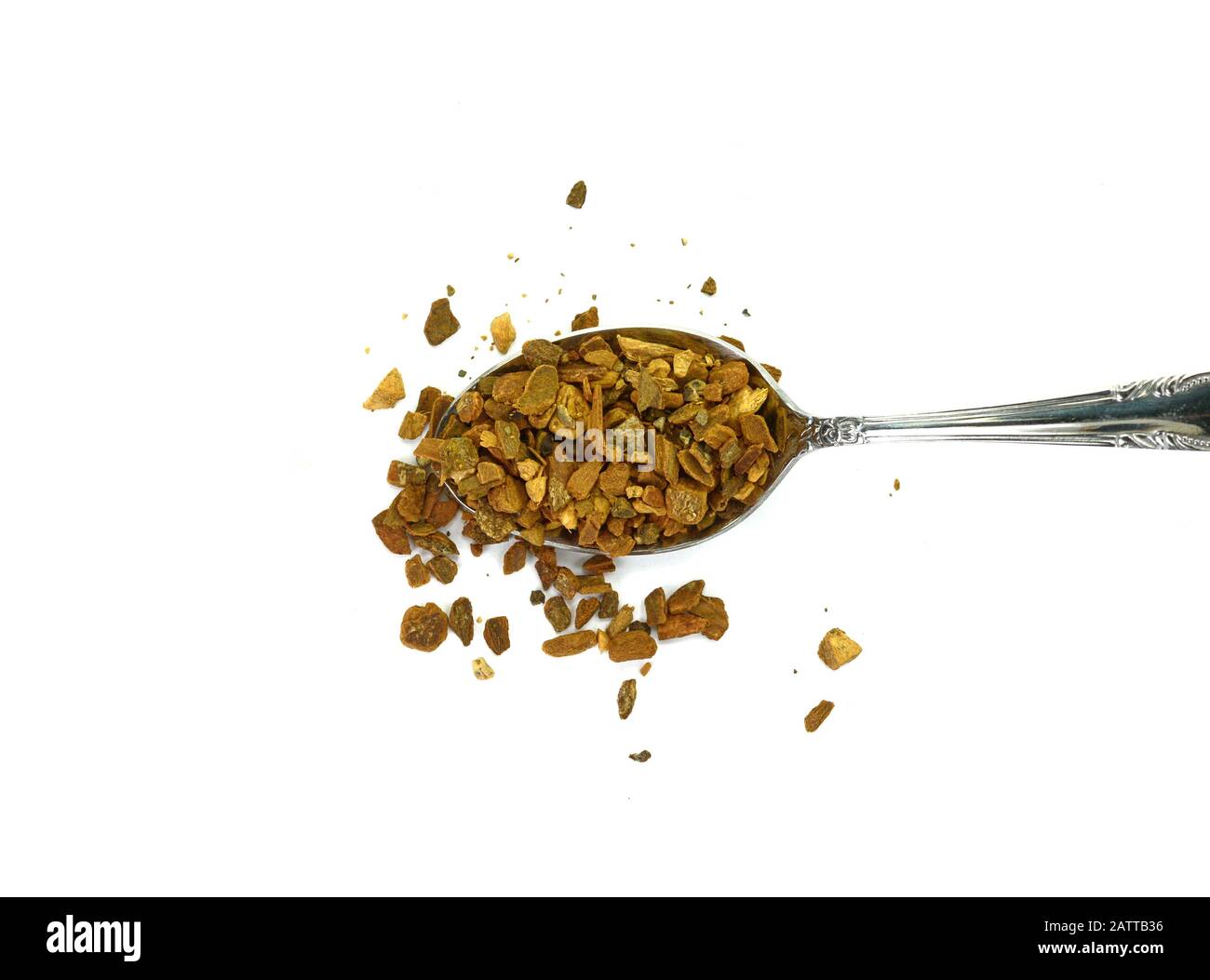 Indian chai tea, cinamon and ginger in a metal spoon isolated on white ...