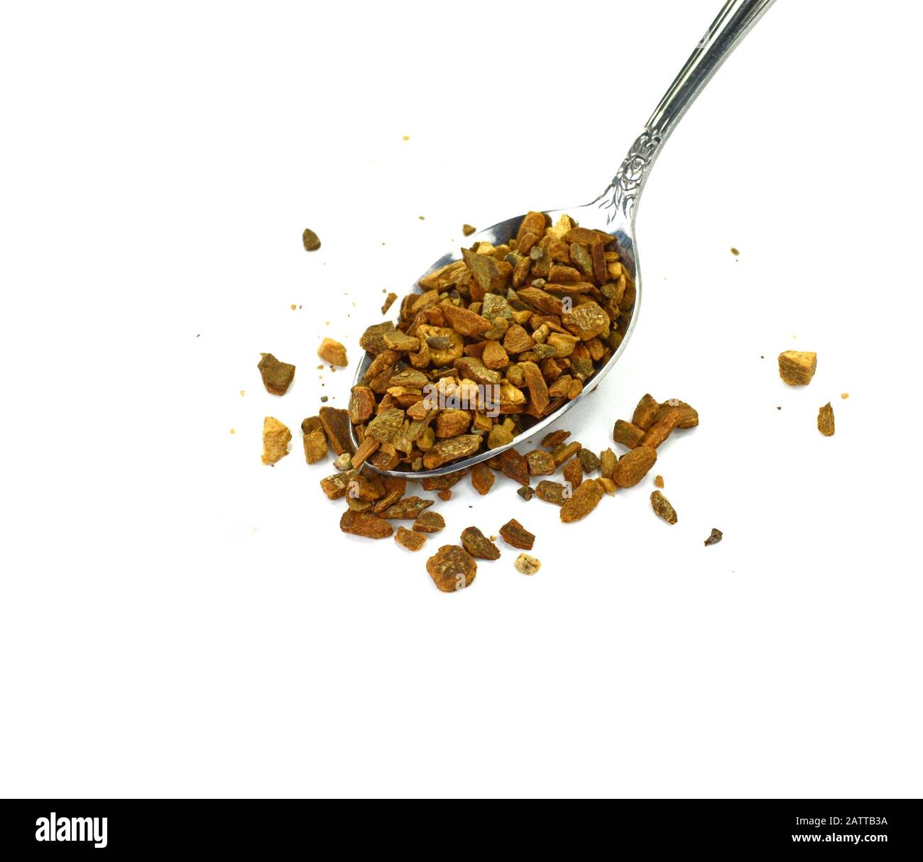 Indian chai tea, cinamon and ginger in a metal spoon isolated on white ...