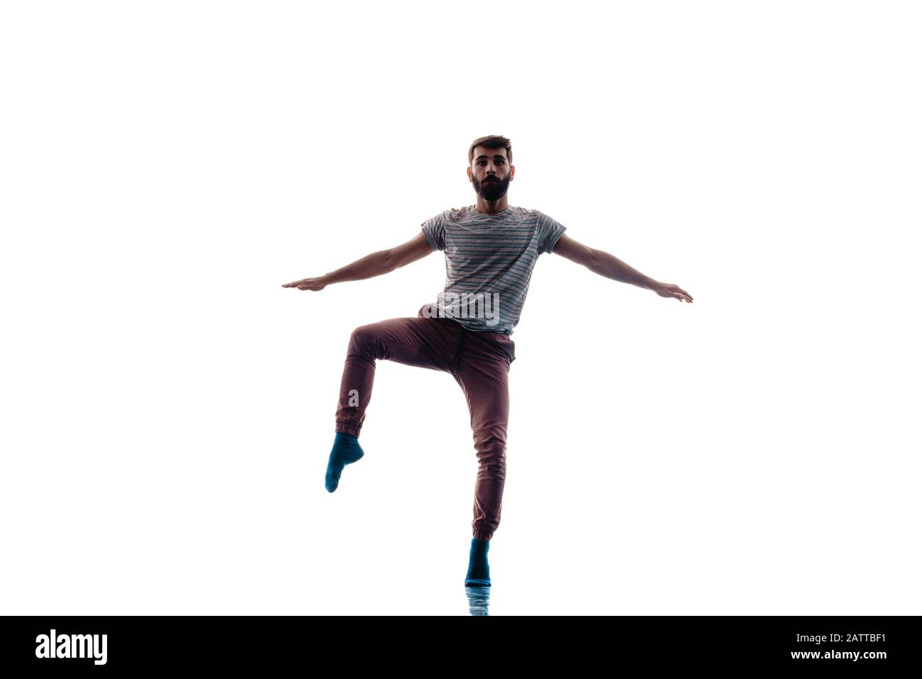 Muscular male dancer performing a dance routine in the studio Stock ...