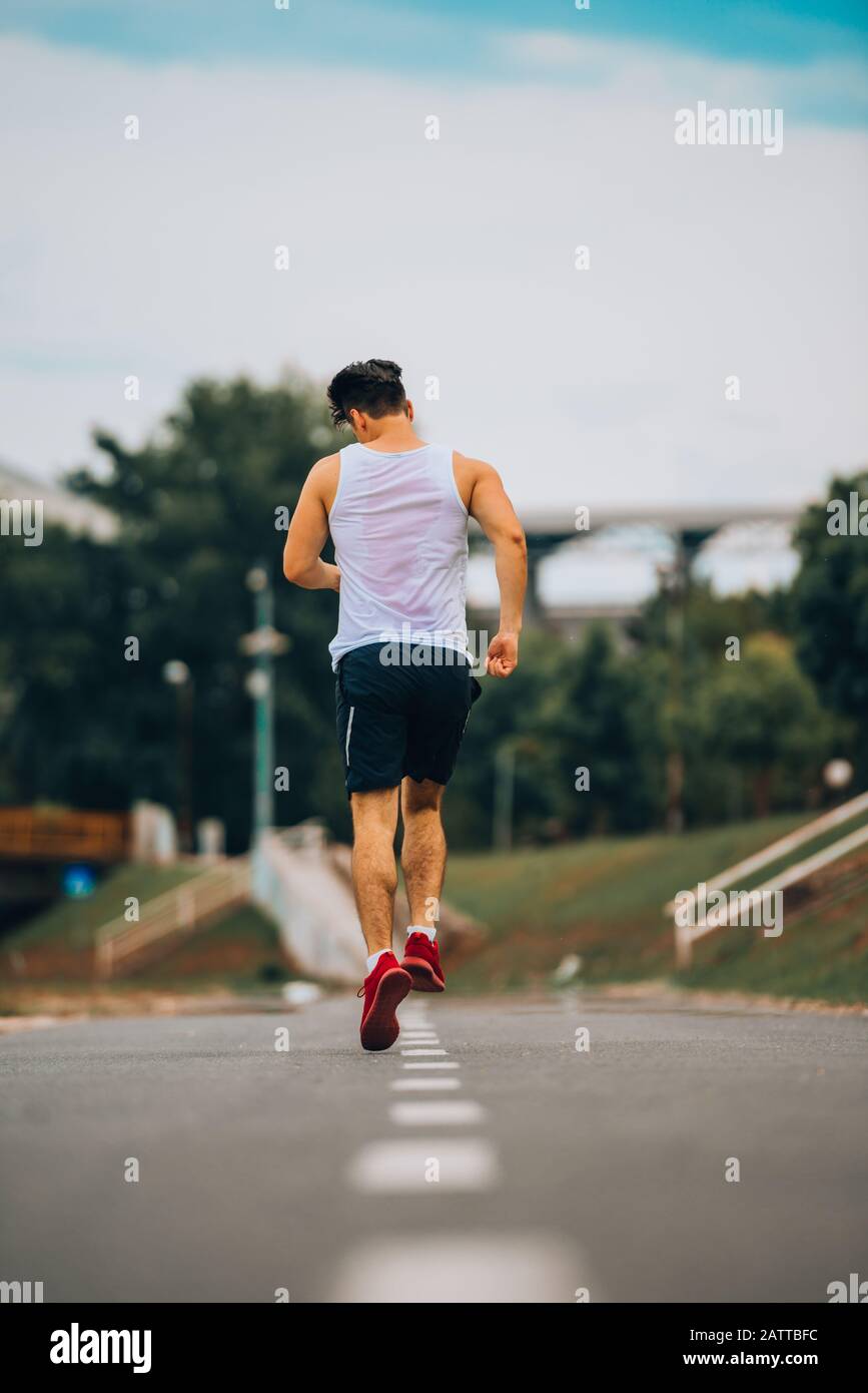 Sporty man running fast. Sport, athletics, fitness, jogging activity ...