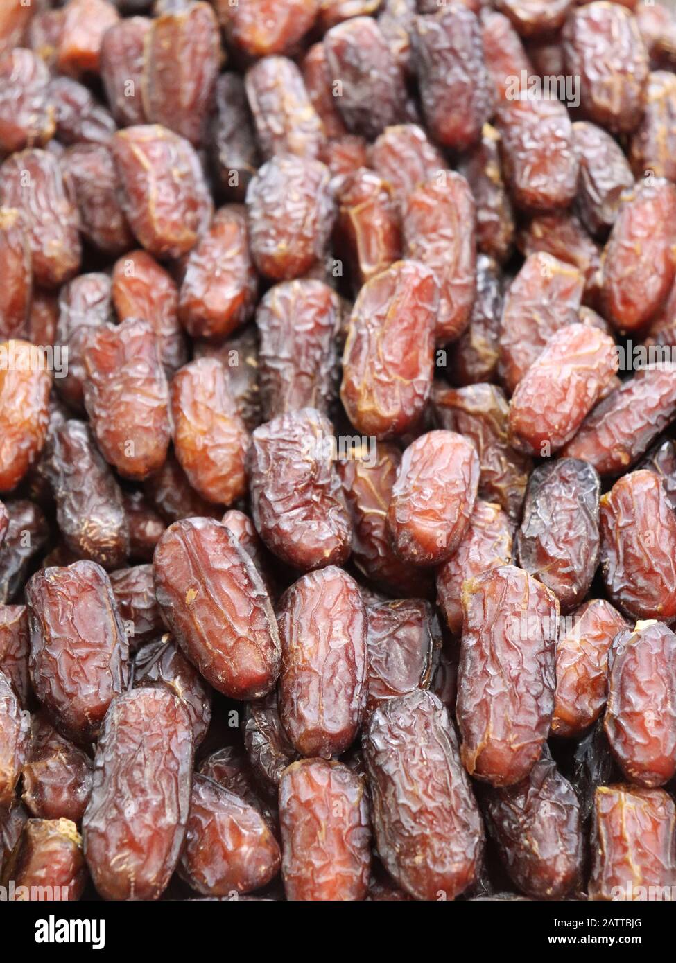 Ripe dates fruit backgrounds. Pile of dates fruits in a shop Stock ...