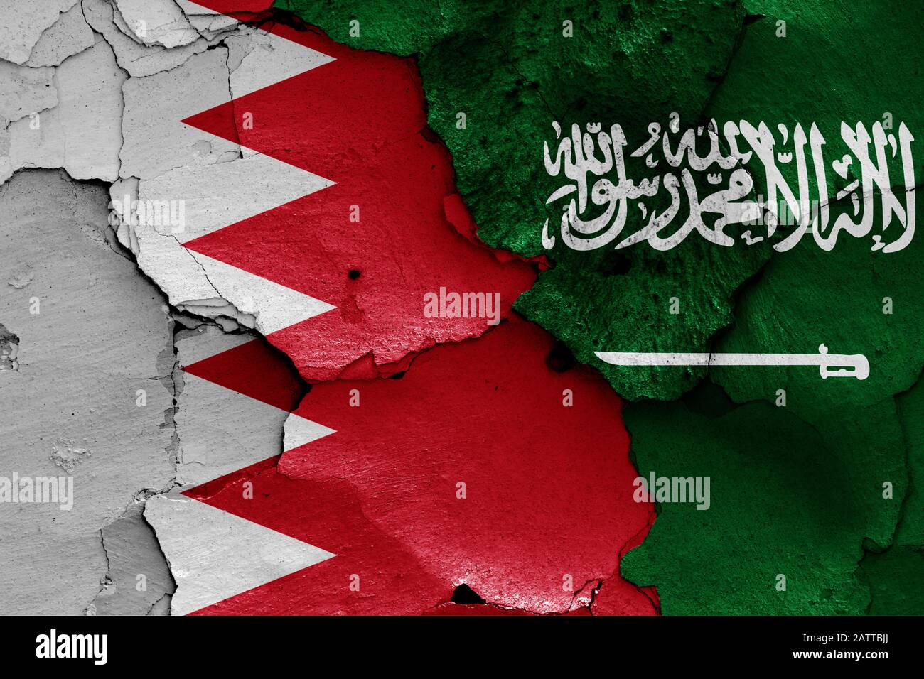 flags of Bahrain and Saudi Arabia painted on cracked wall Stock Photo ...