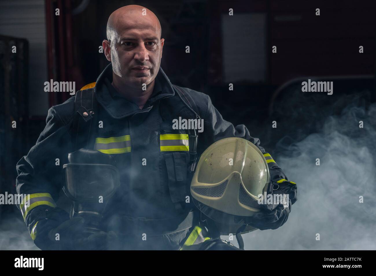 Fireman standing confident holding helmet and wearing firefighter ...