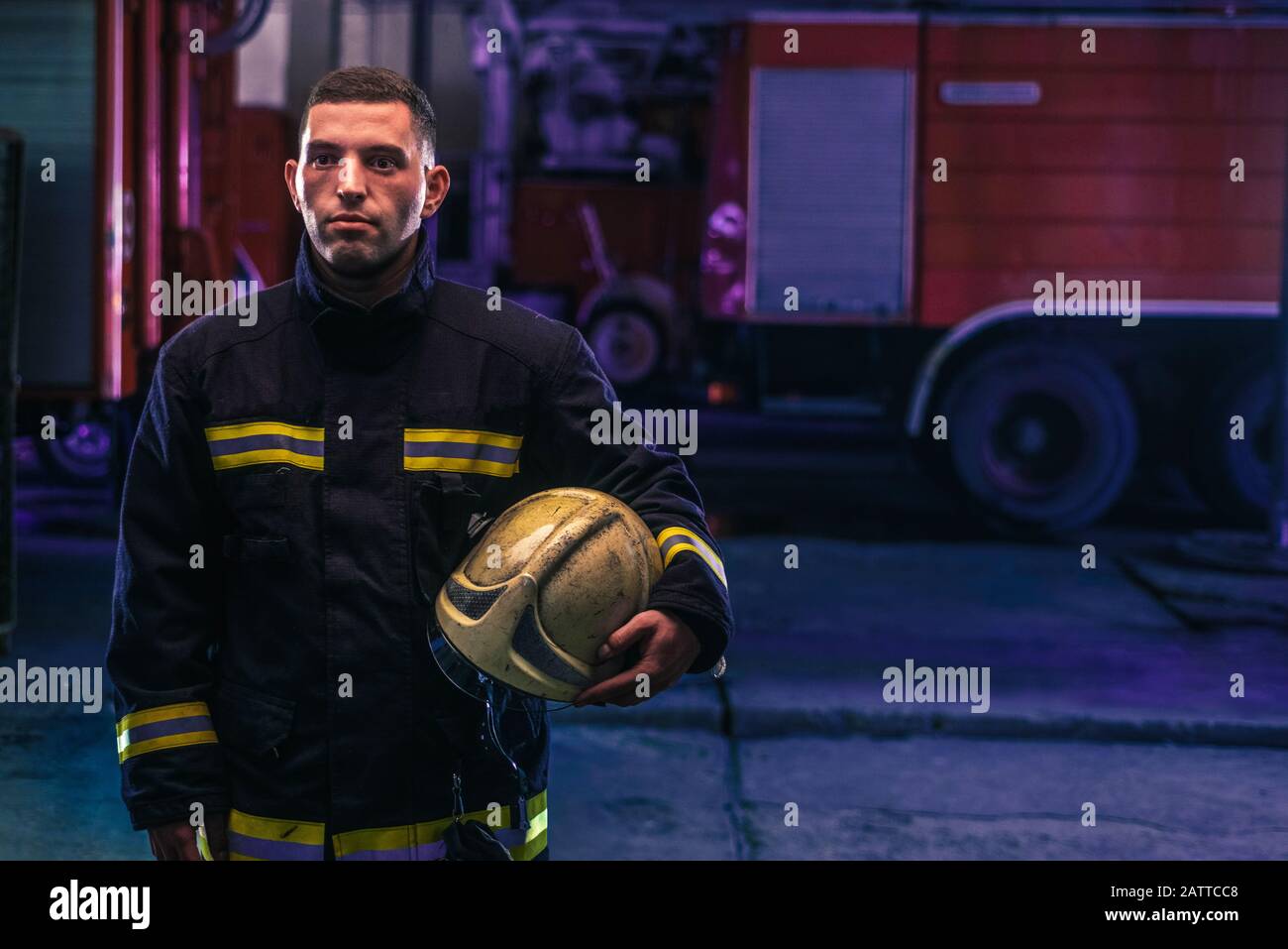 Portrait of a firefighter with uniform inside the fire station Stock ...