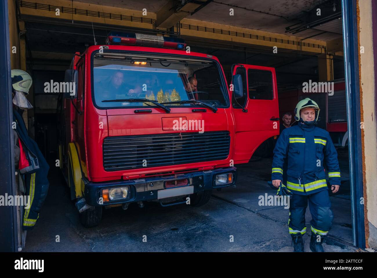 Fire engine inside the garage of the fire department Stock Photo - Alamy