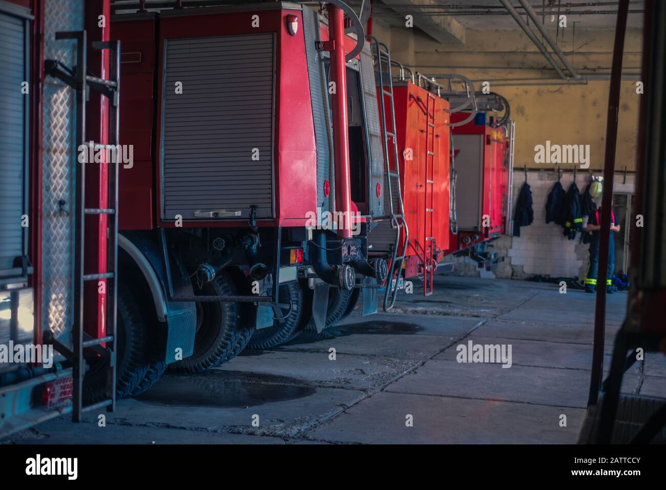 Fire engines parked inside the garage of the fire brigade Stock Photo ...