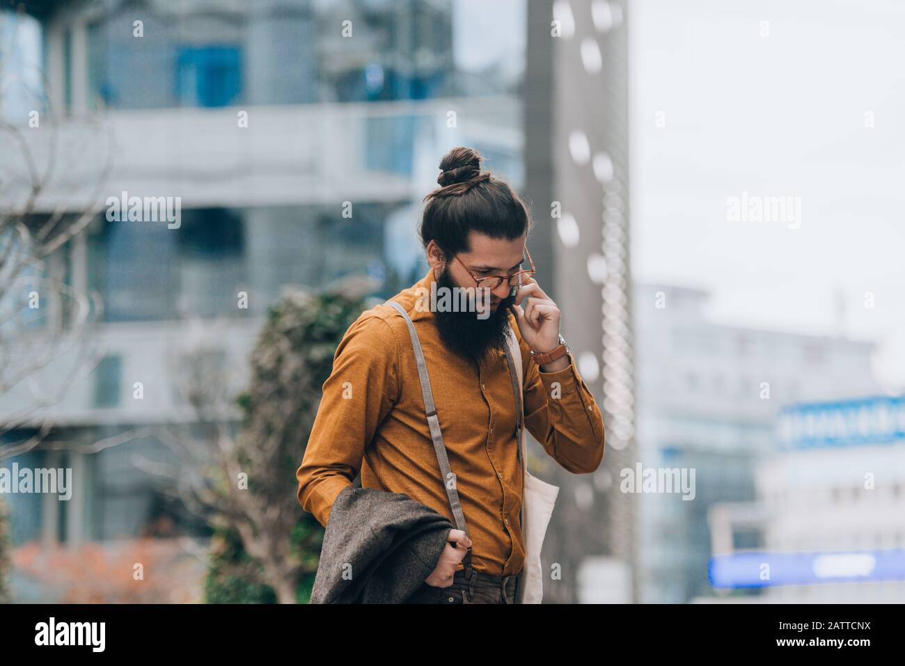Modern day hipster wearing classy outfit at downtown promenade Stock ...