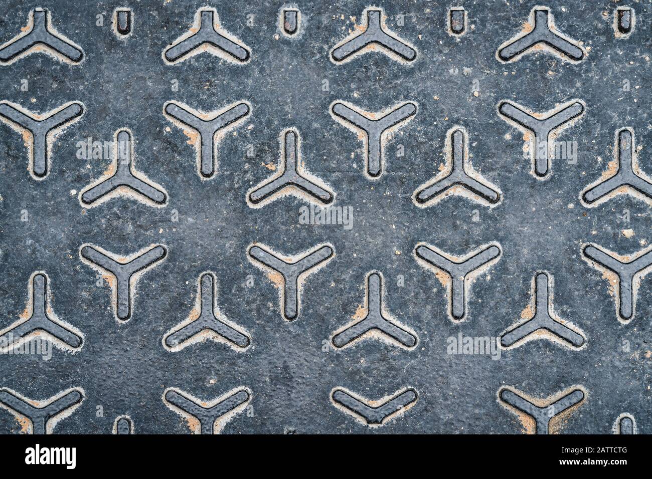 Geometric pattern of a metal manhole cover Stock Photo - Alamy