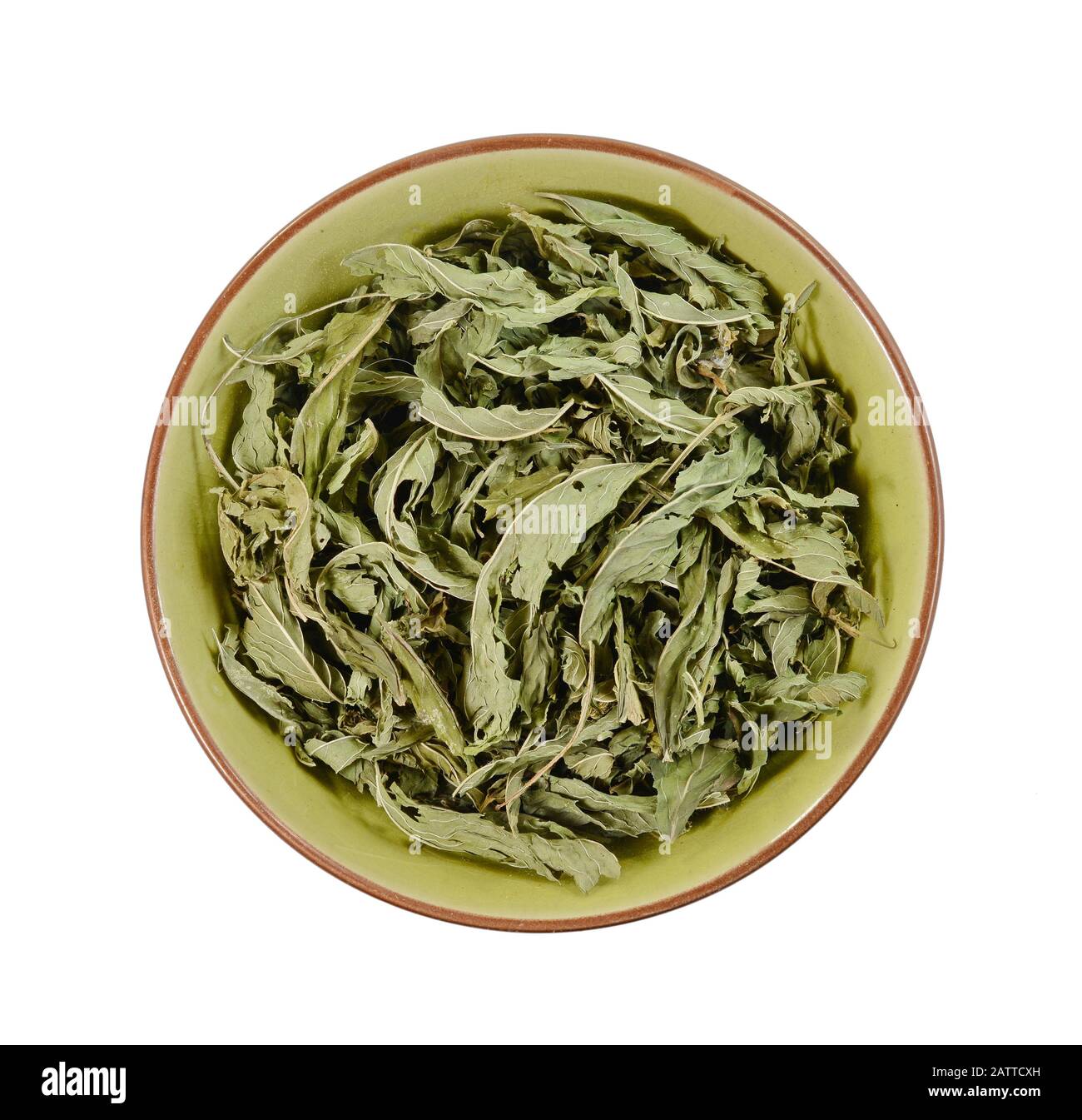 Dried mint tea in a ceramic bowl on a white background Stock Photo - Alamy