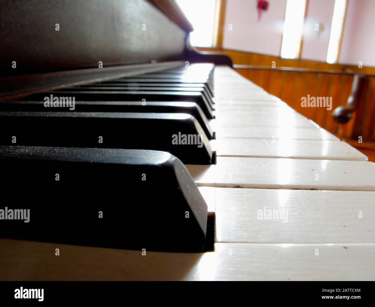 Keyboard on an old piano Stock Photo - Alamy