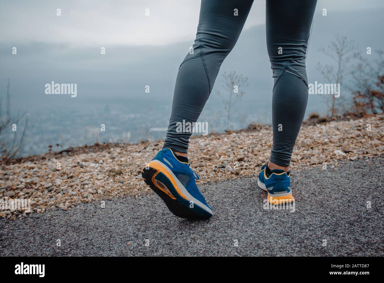 Healthy fit middle aged runner during a warm up routine before running ...