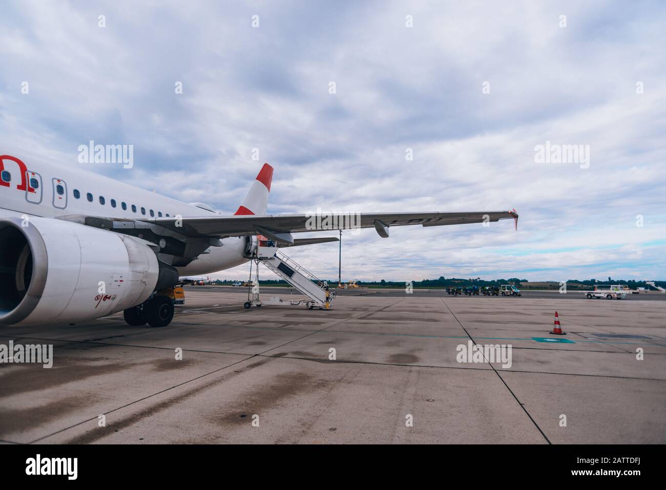 Airplane with an portable staircase attached to it for boarding ...
