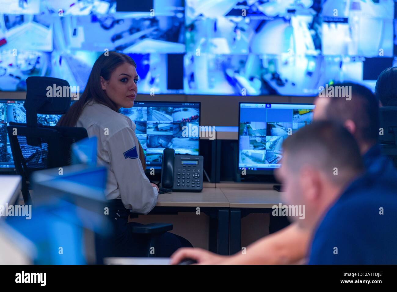 In the System Control Room, Technical Operator Works at His Workstation with Multiple Displays ...