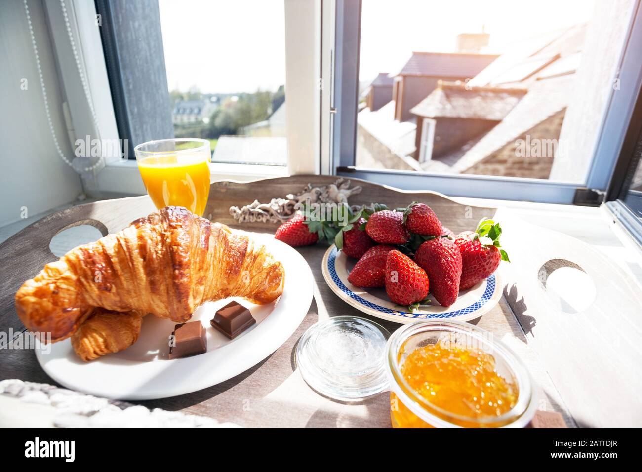 delicious French breakfast on a tray with a view of the castle Stock ...
