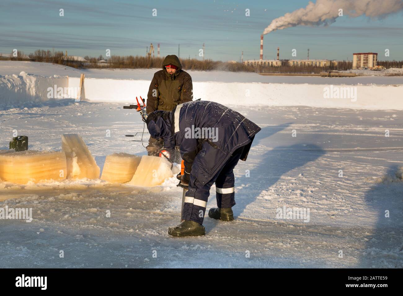 Worker cuts the ice with a gasoline saw Stock Photo - Alamy