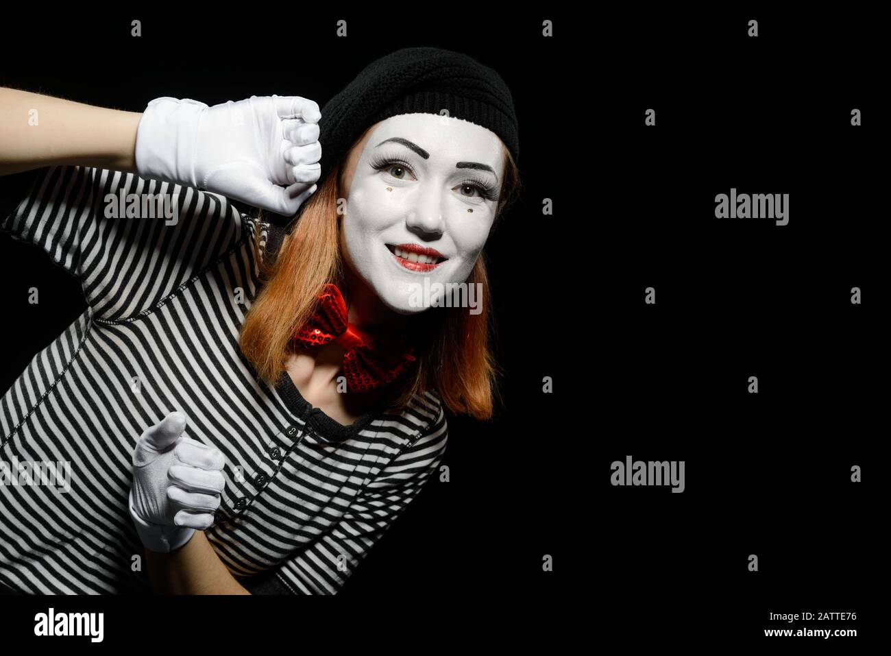 Pantomime actress leaning on wall. Portrait of smiling woman Stock ...