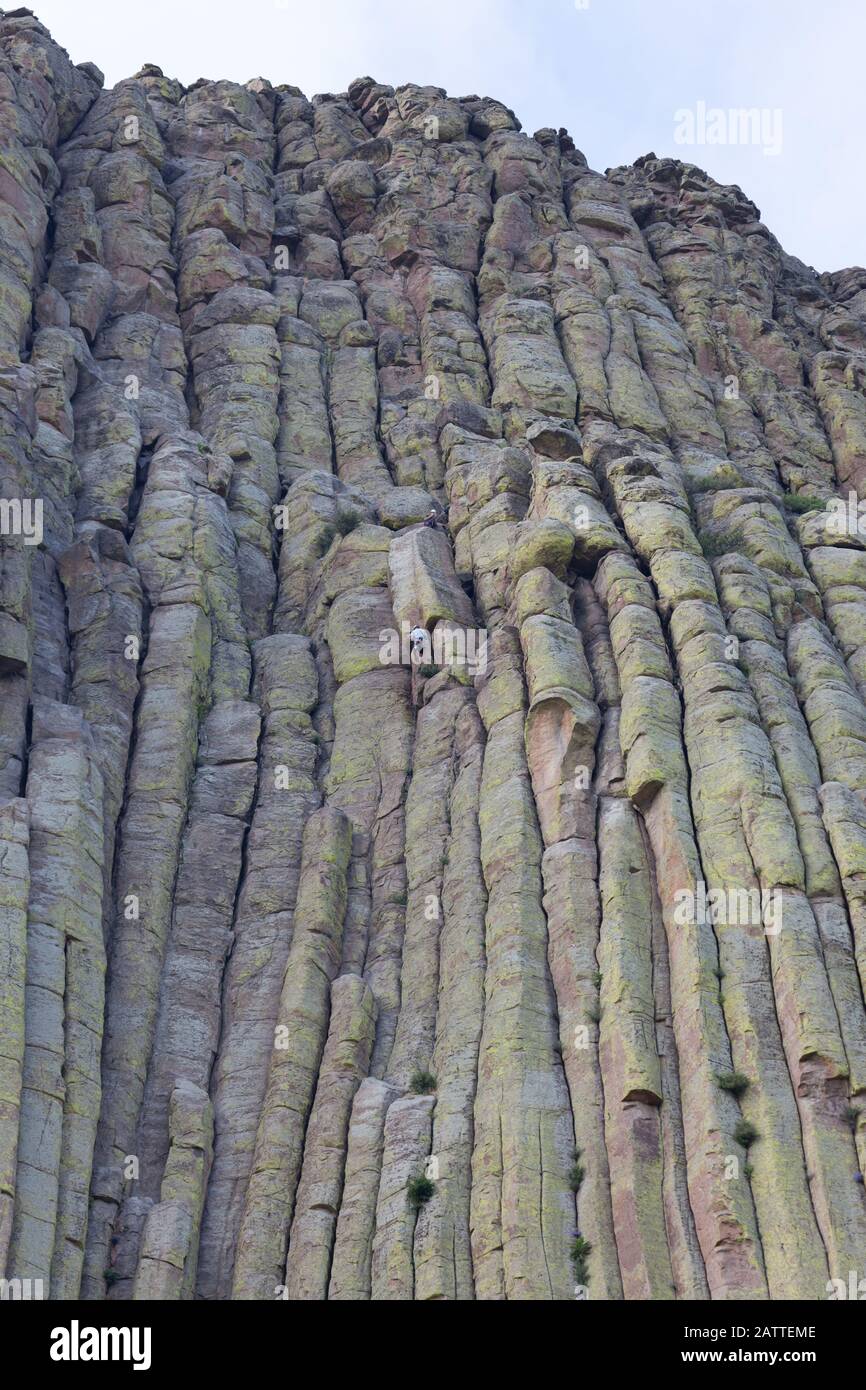 Unidentifiable people use rope and gear to climb the spectacular ...