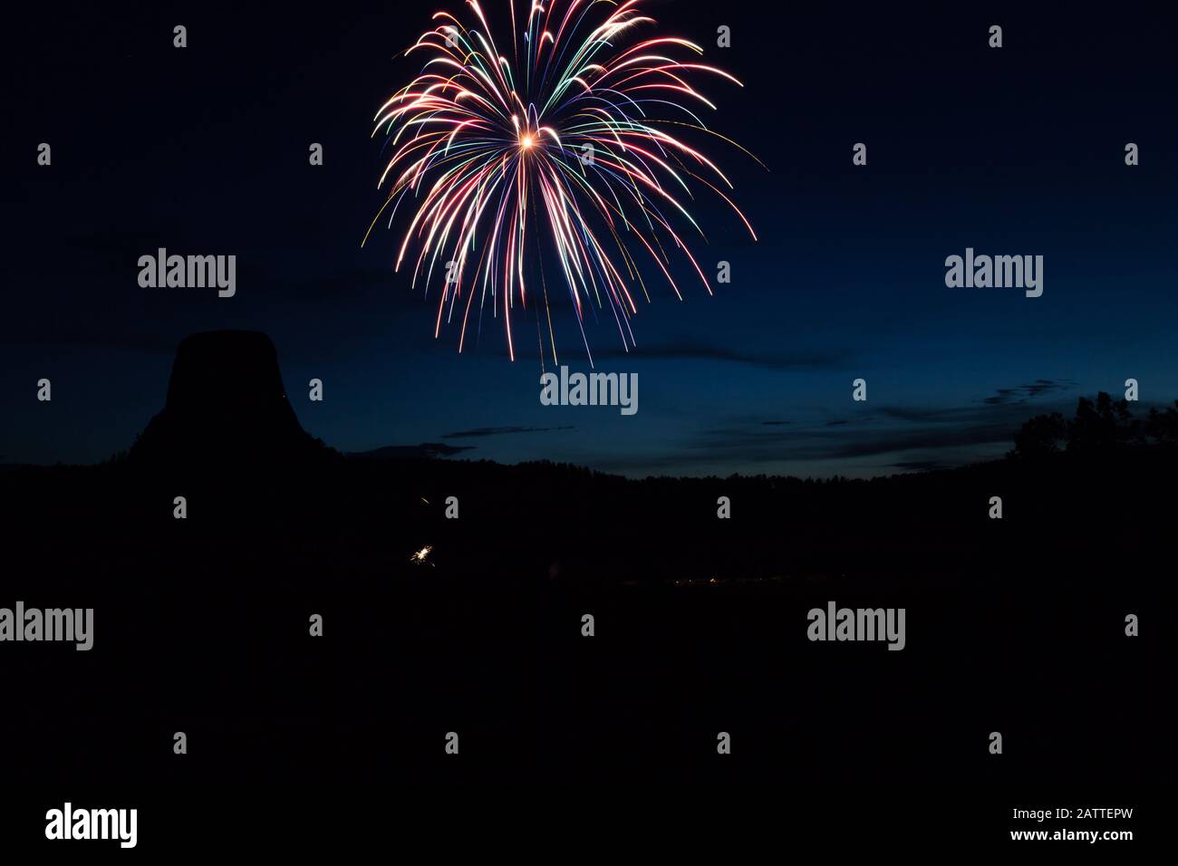 A colorful explosion of fireworks on the Fourth of July at twilight ...