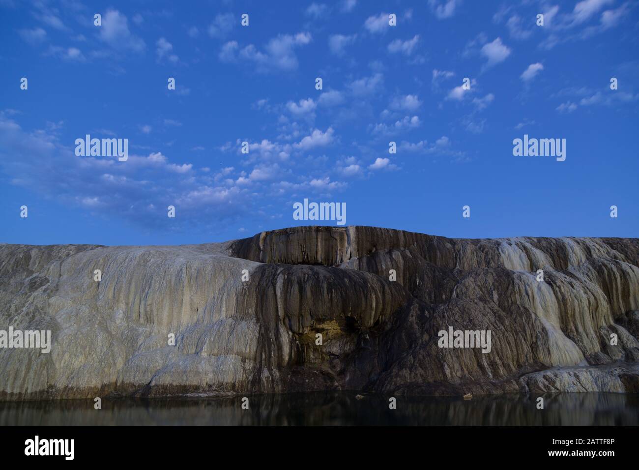 Travertine and gypsum layers left from many years of hot mineral water ...