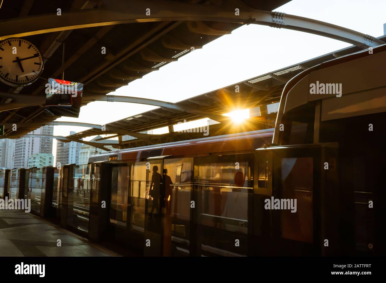 Train station with the sun at evening Stock Photo - Alamy