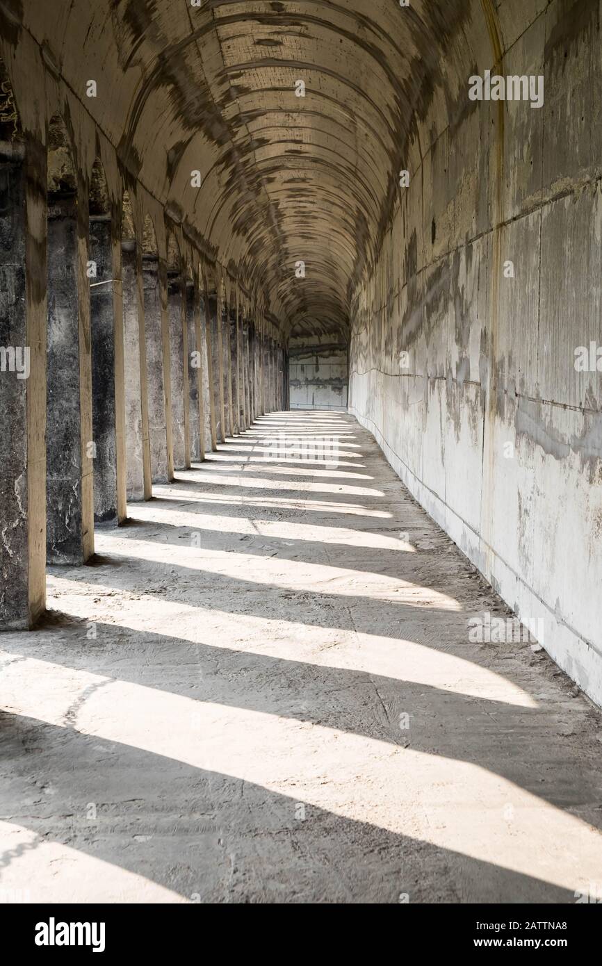 The traditional cement brick arch door with the shadow, it’s walkway ...