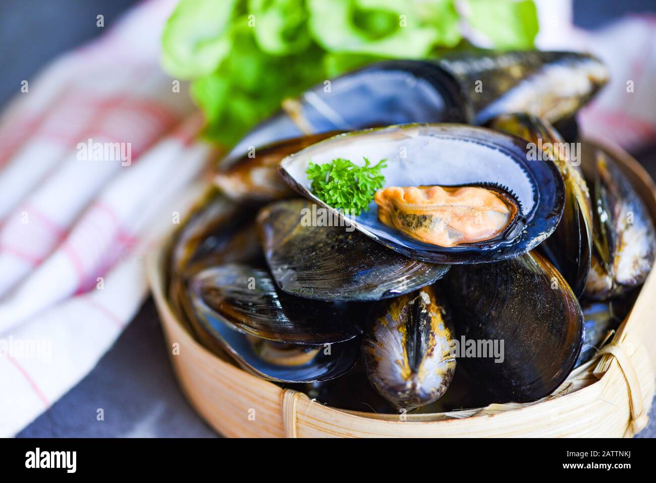 Mussels with herbs lemon on cook steamer food background / Fresh ...