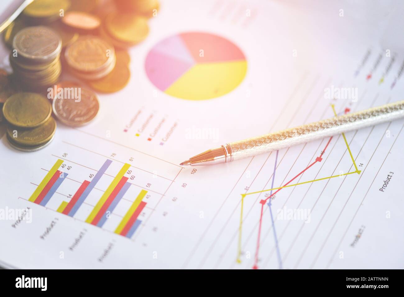 Business report graph chart with coin and pen on report paper document ...