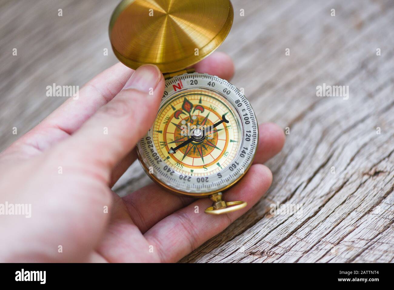 Man explorer searching direction with compass for map / Navigational ...