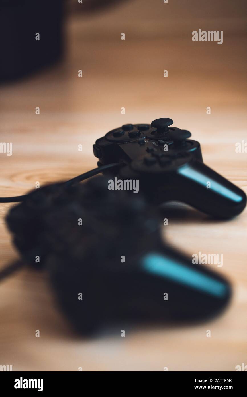 Game consoles on parquet floor. Player Concept Stock Photo - Alamy