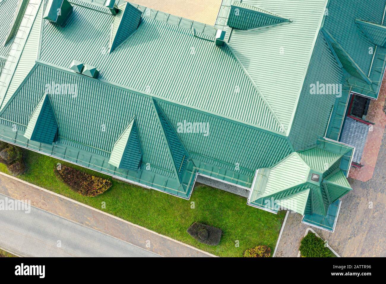 aerial top down photo of green tiled metal sloping roof with dormer ...